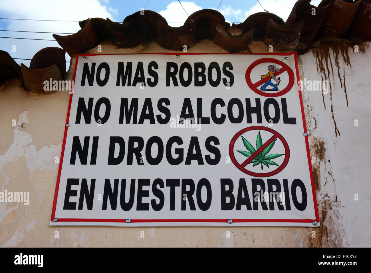 Sign in Spanish language saying "No more robberies, no more alcohol nor ...