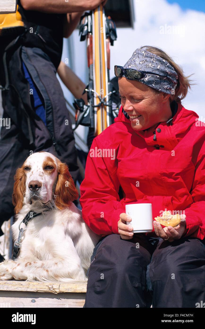 A woman and a dog taking a break Stock Photo - Alamy