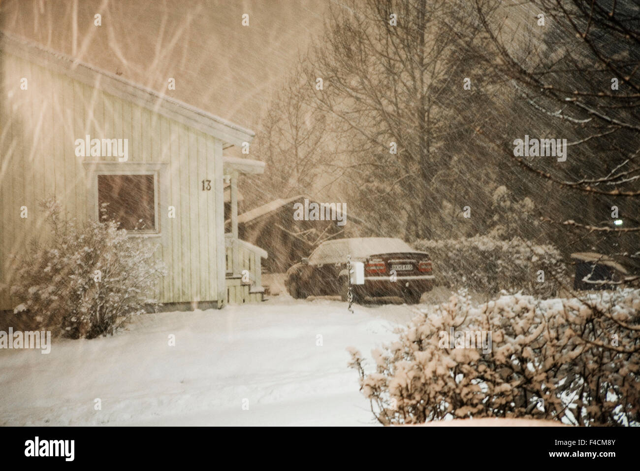Snow storm by a house Stock Photo - Alamy