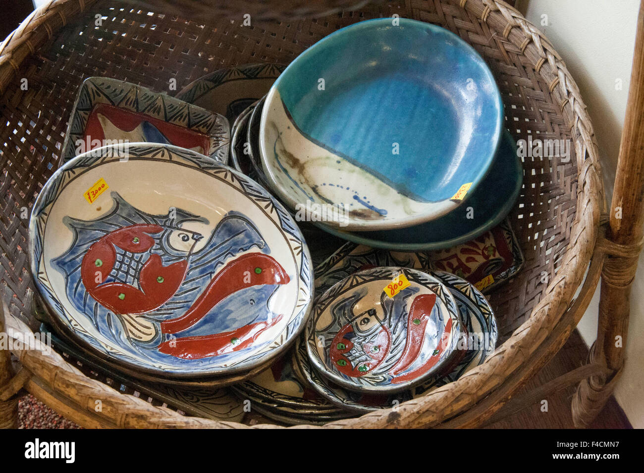 Basketful of classic and colorful classic Tsuboya ceramic bowls in shop ...