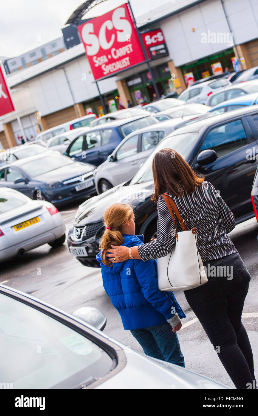 Middle class mum and daughter GV's , retail units and shoppers at ...