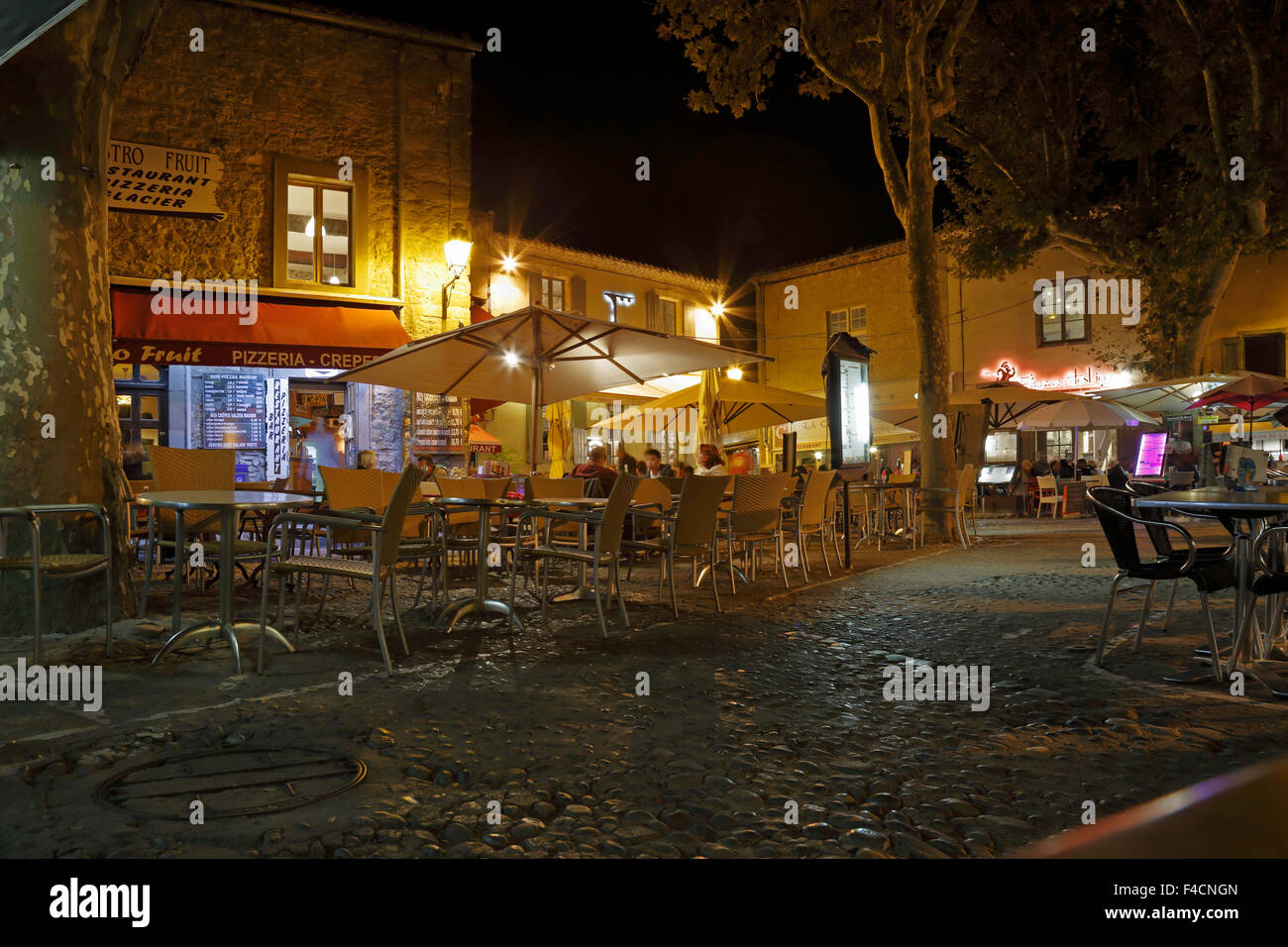 Restaurants inside the medieval castle fortress at night, Carcassonne ...