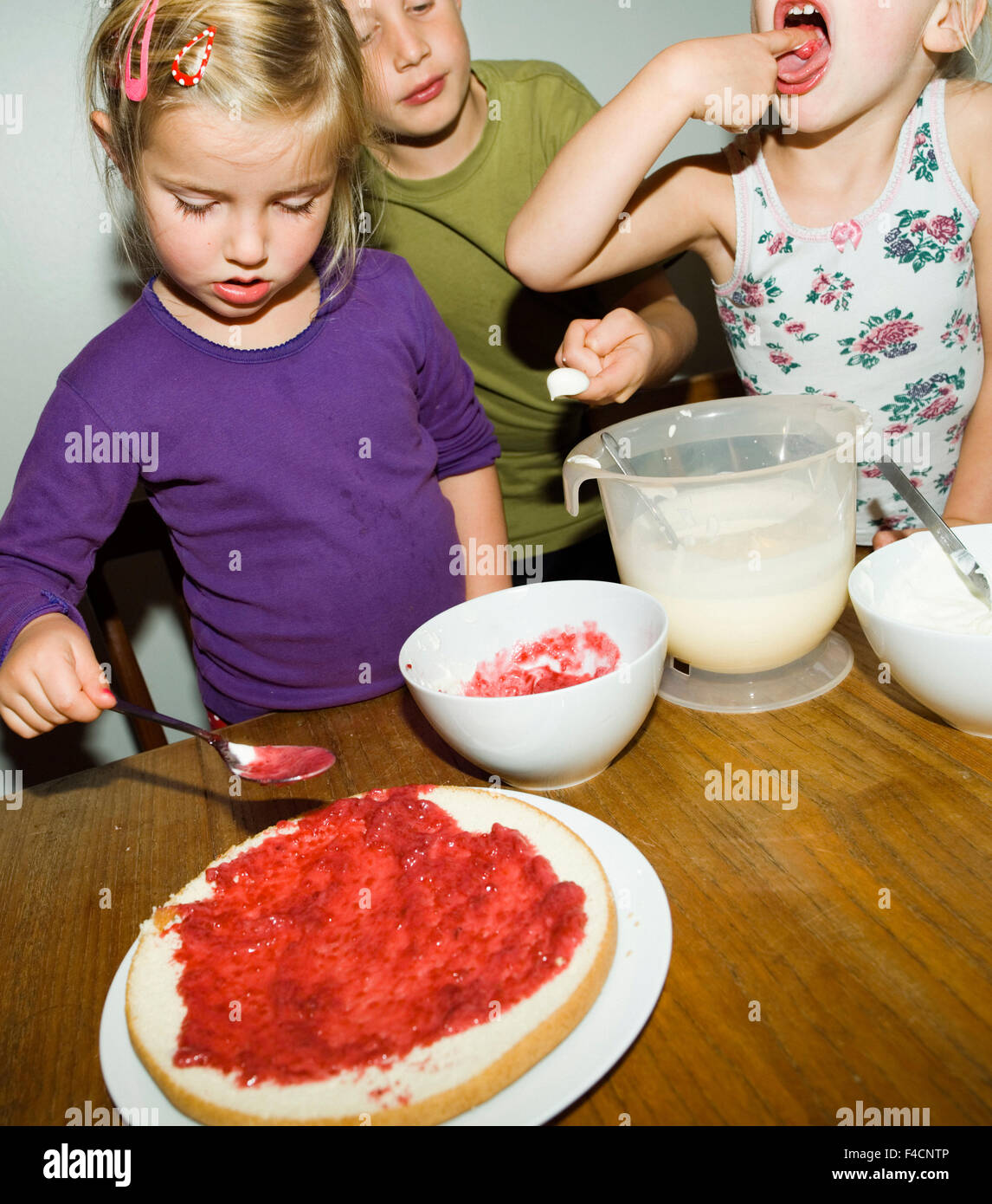 Children baking a cake Stock Photo - Alamy
