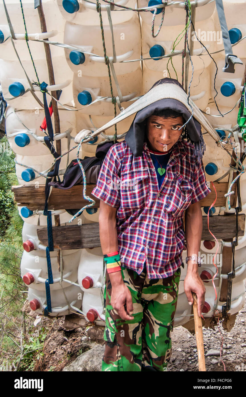 Porter carrying load, Nepal Stock Photo - Alamy