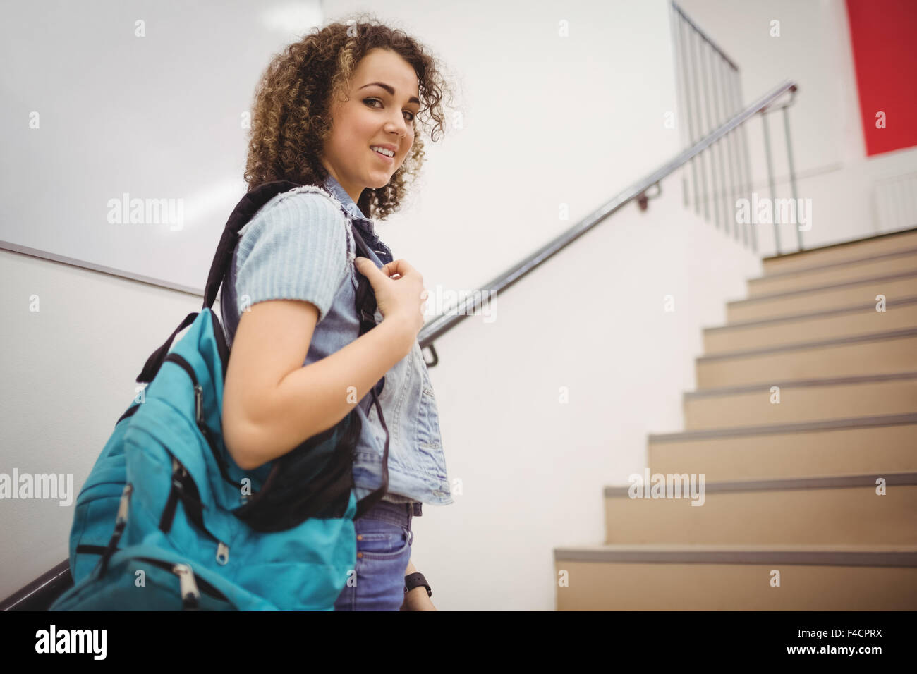 Pretty student on the stairs Stock Photo - Alamy
