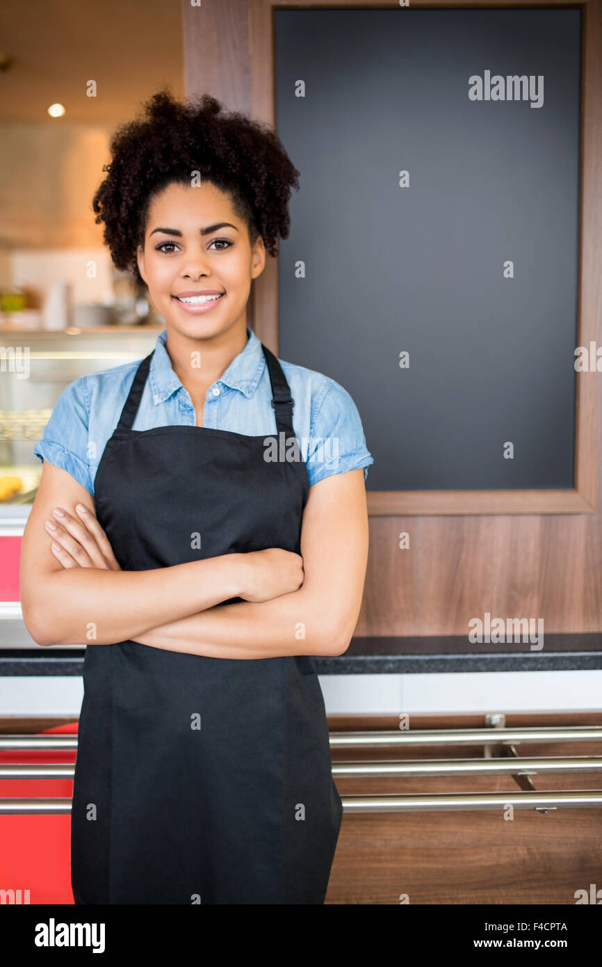 Pretty waitress smiling at camera Stock Photo - Alamy