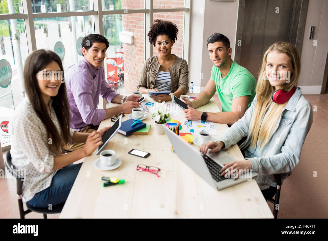 Students working on assignments together Stock Photo - Alamy