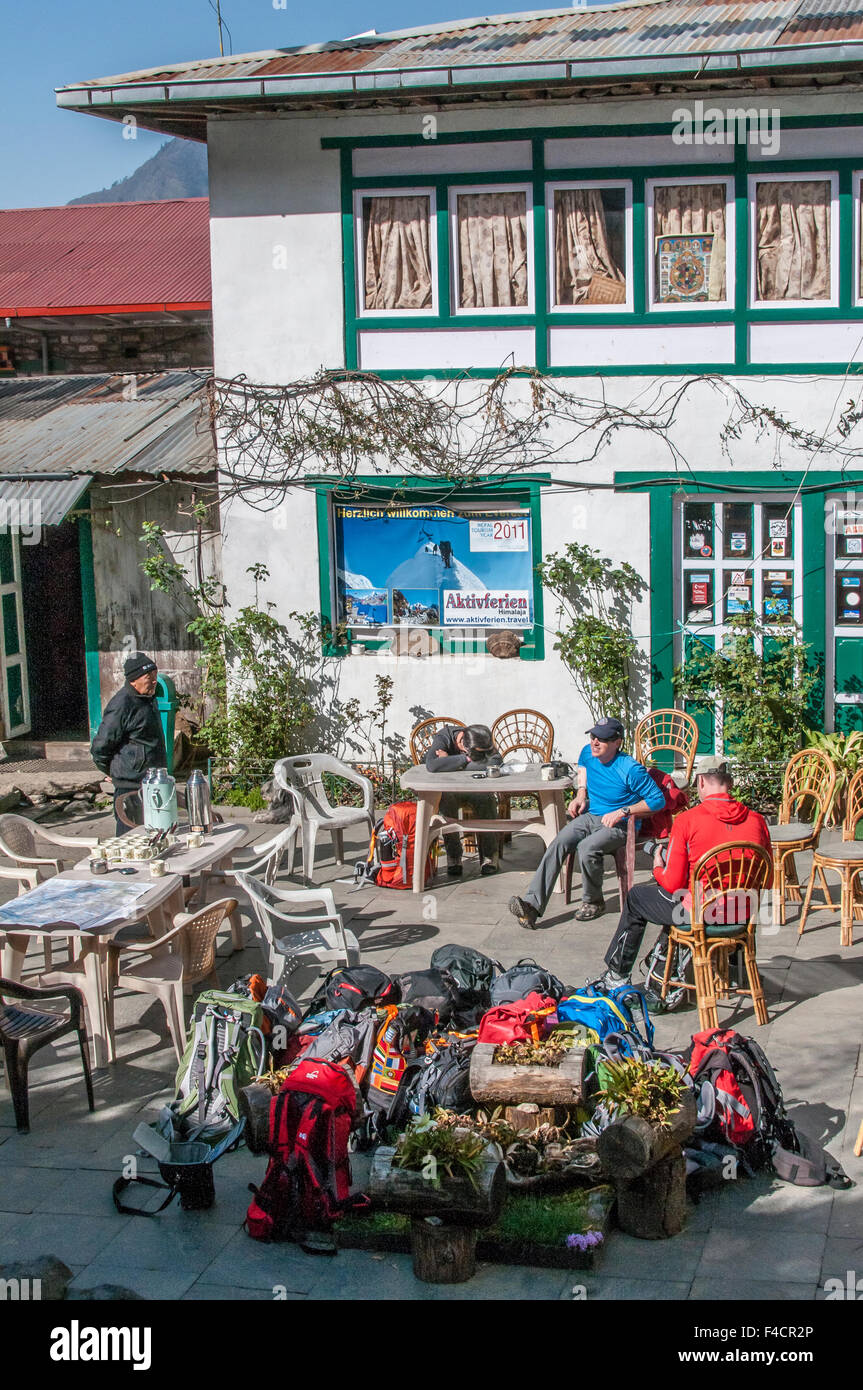Trekkers resting in teahouse courtyard, Lukla, Nepal Stock Photo - Alamy
