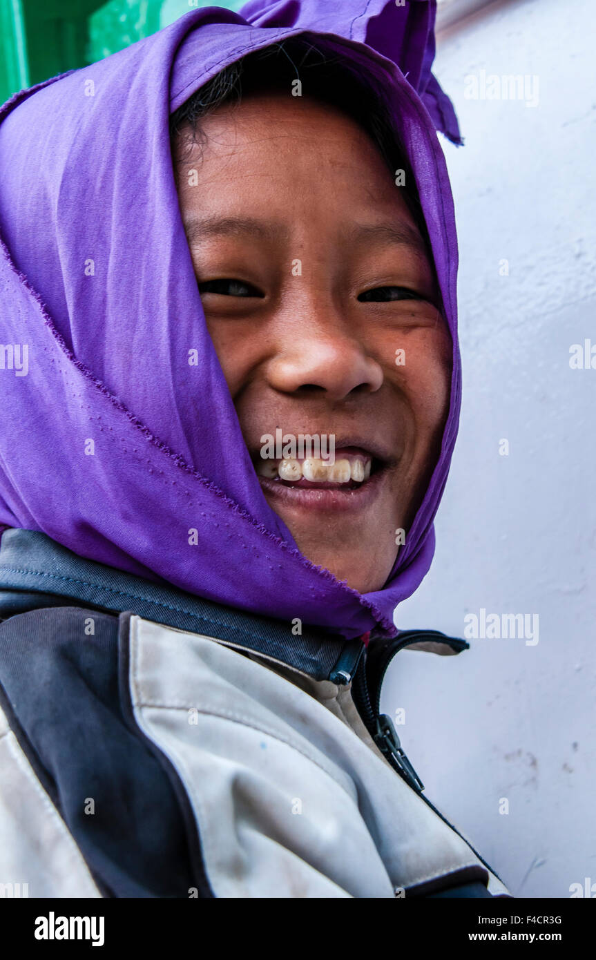 Woman with purple scarf, Nepal Stock Photo - Alamy