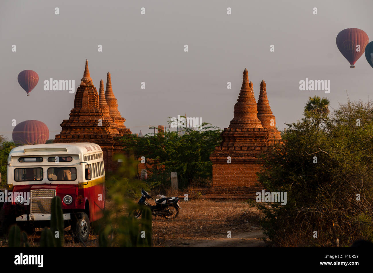 Bus Pagoda Stupa and hot air balloon over Bagan Stock Photo - Alamy