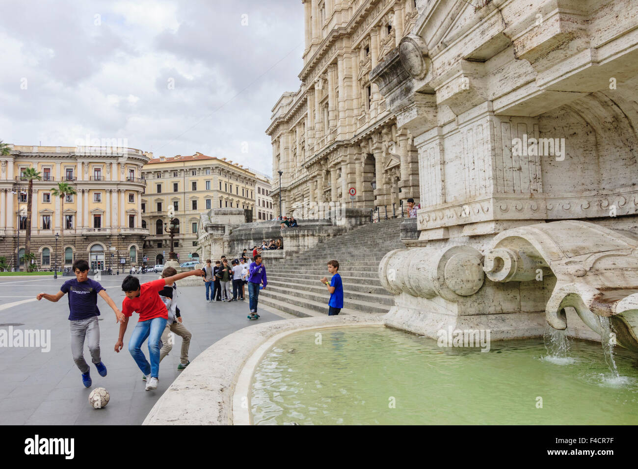 Italian teens playing football next to the Palace of Justice in Piazza ...