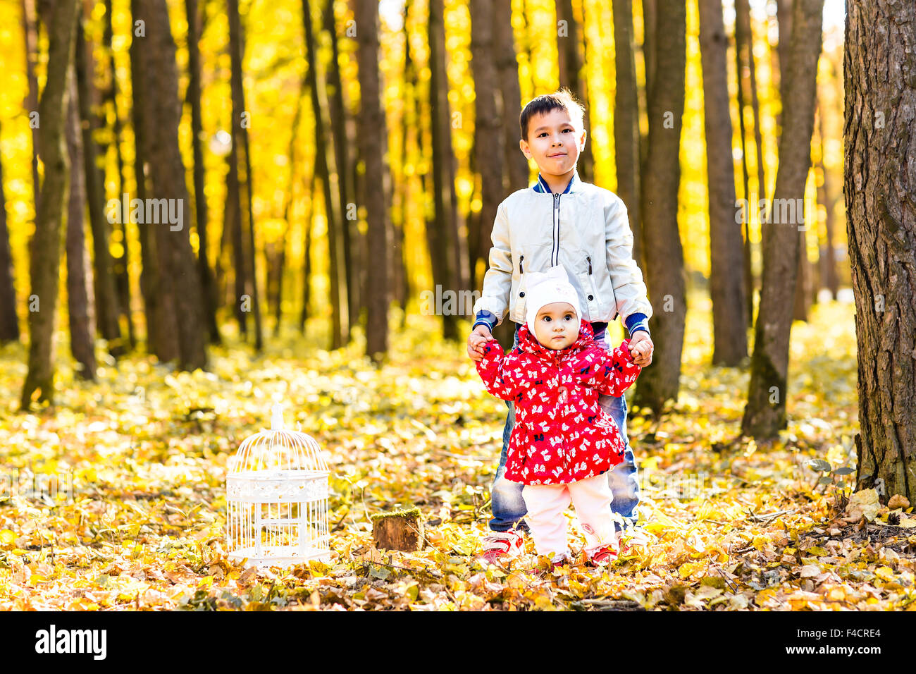Children in autumn park Stock Photo - Alamy