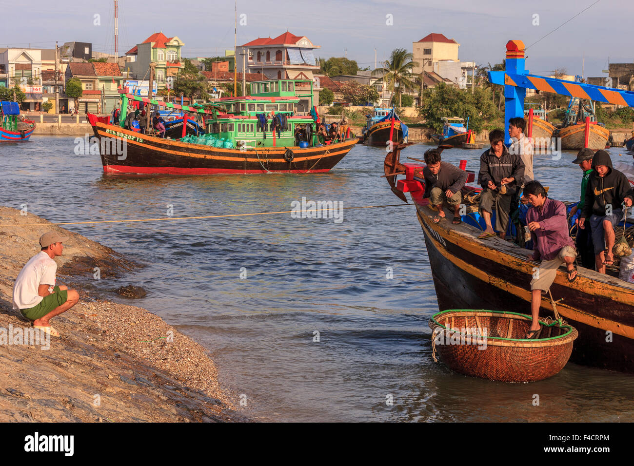 Off-loading the ship. Phan Thiet harbor. Bhin Thuan Province. Vietnam ...