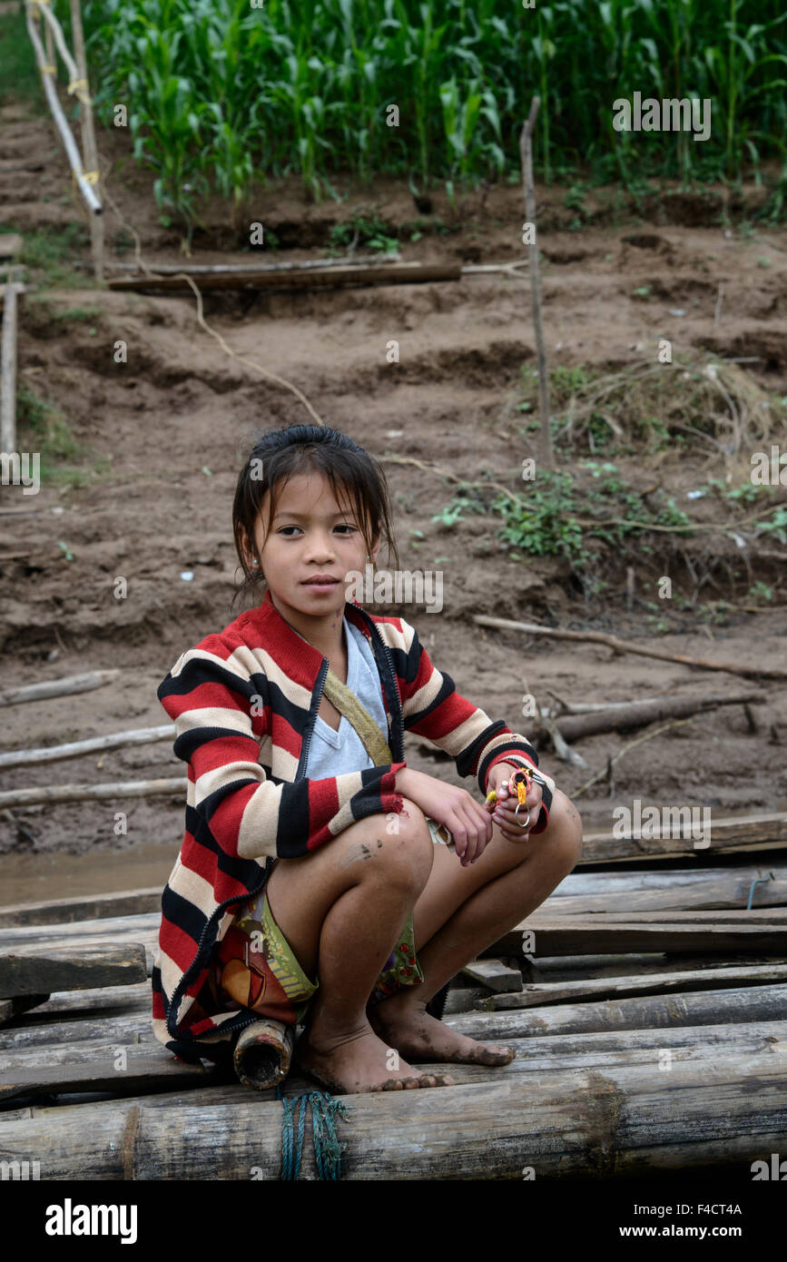 Laos, Luang Prabang. Girl at river side. (Large format sizes available ...