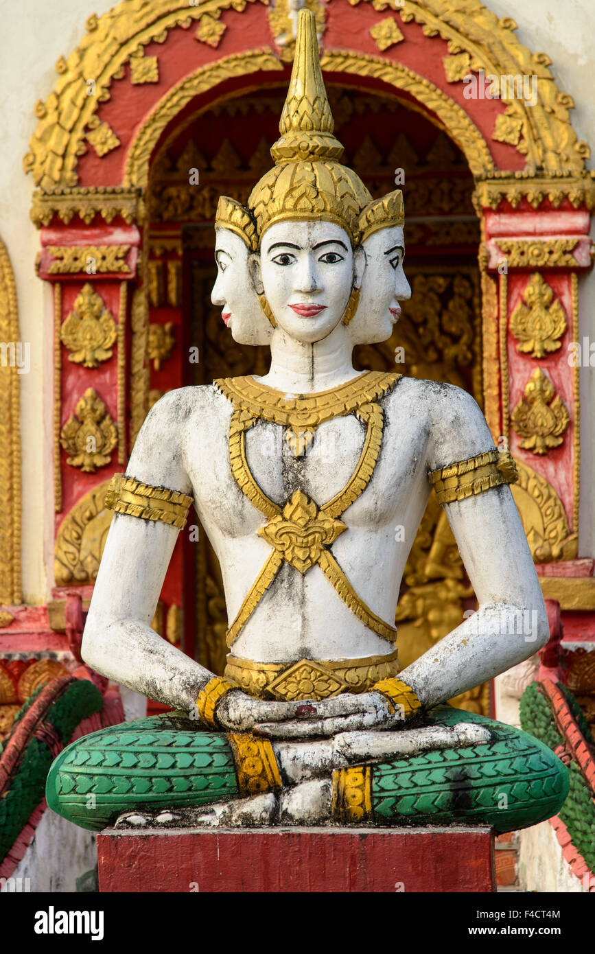 Laos, Vang Vieng. Three-faced statue at Buddhist temple. (Large format ...