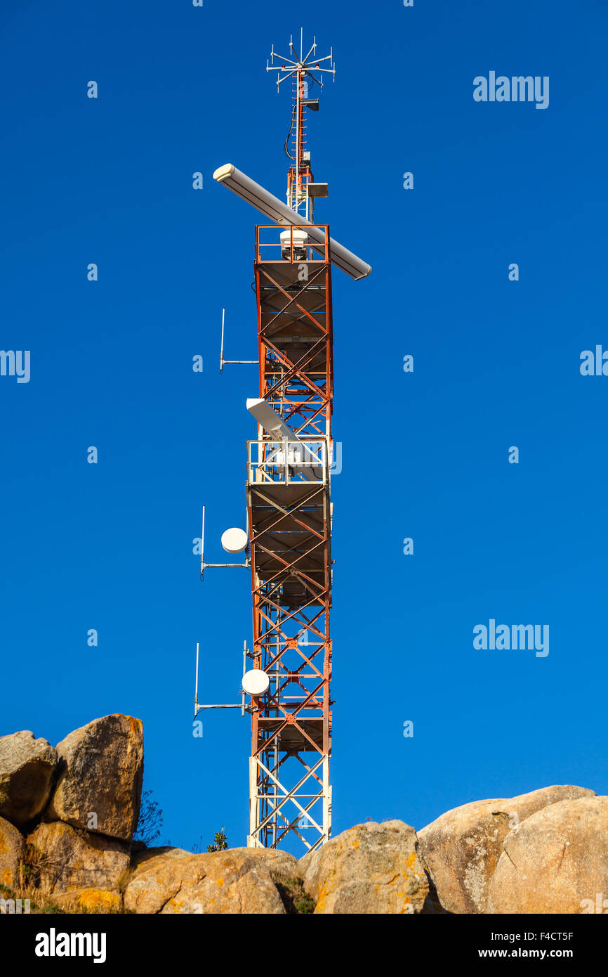 A navigation communication tower against a blue sky Stock Photo - Alamy