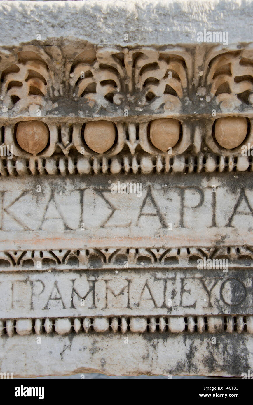 Turkey, Ephesus. Ancient Ephesian ruins, marble carved text with dart ...
