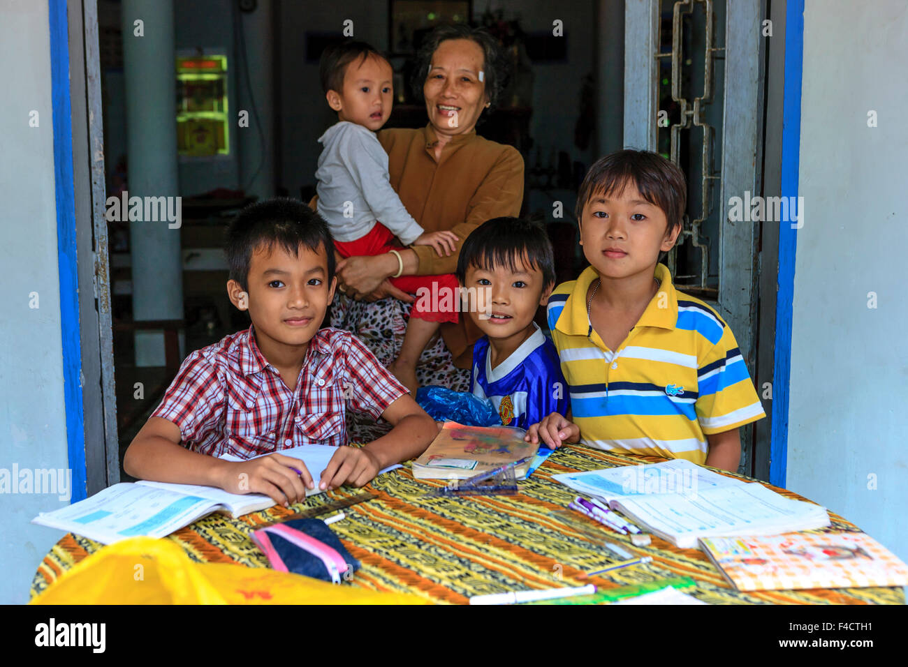 School children do their home work. Vietnam, Indochina, South East Asia ...