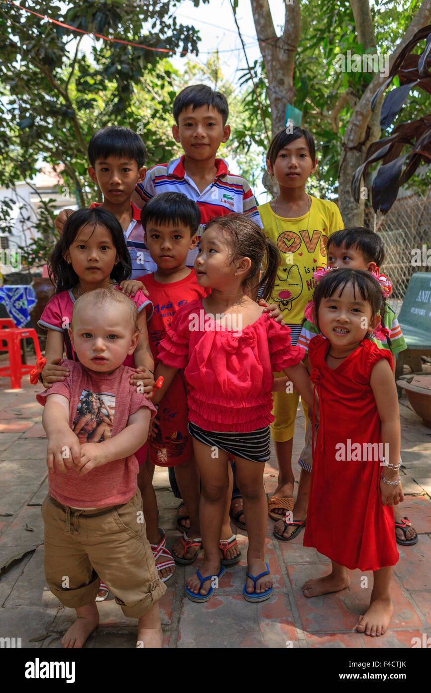 All family. Children posing. Sa Dec. Vietnam, Indochina, South East ...