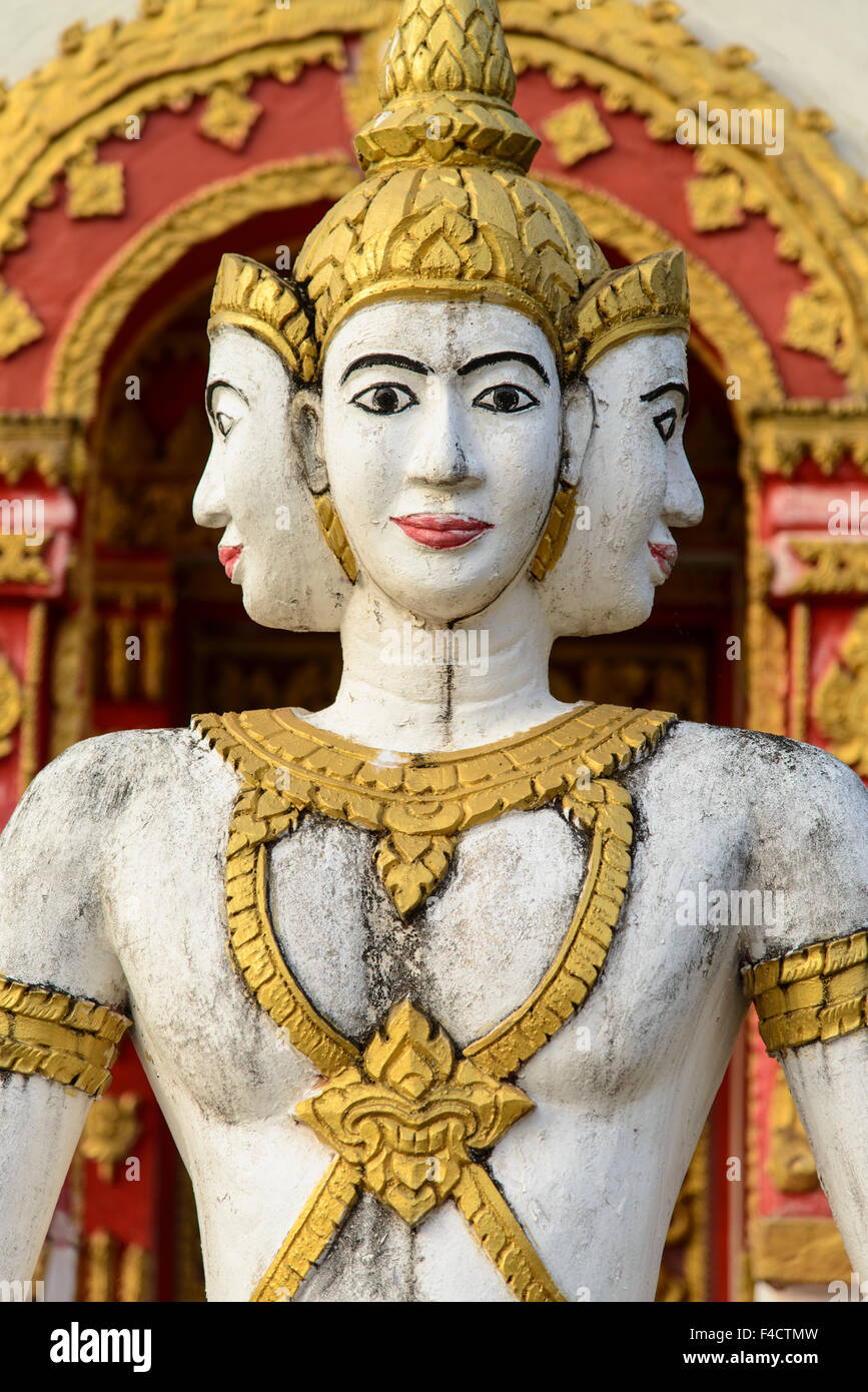 Laos, Vang Vieng. Three-faced statue at Buddhist temple. (Large format ...