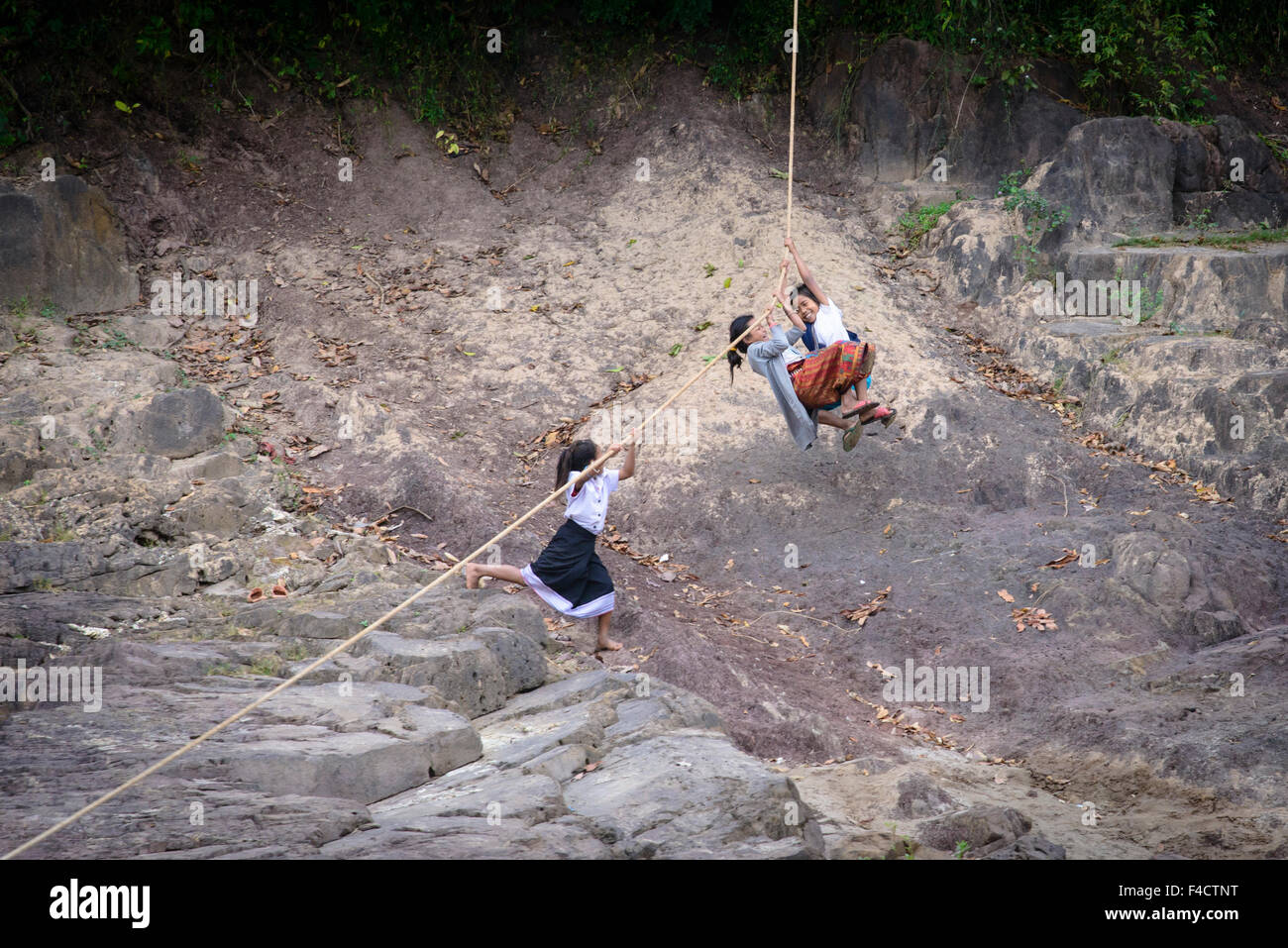 Luang prabang girls playing on rope hi-res stock photography and images ...