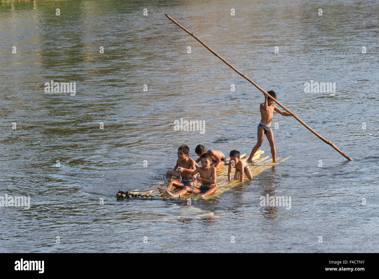 Boys playing on raft hi-res stock photography and images - Alamy