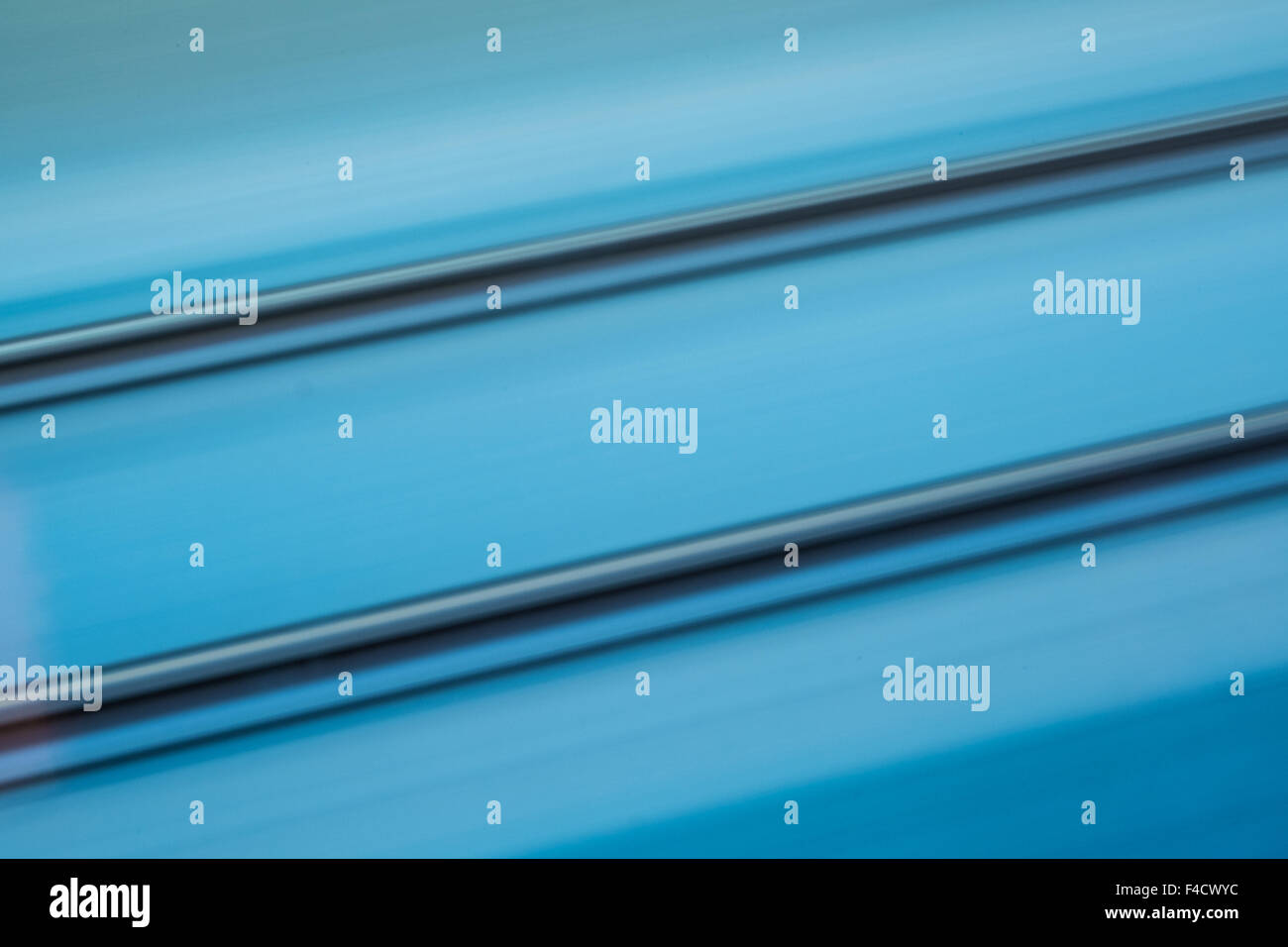 Blue blurred railway tracks as ascending diagonal Stock Photo - Alamy