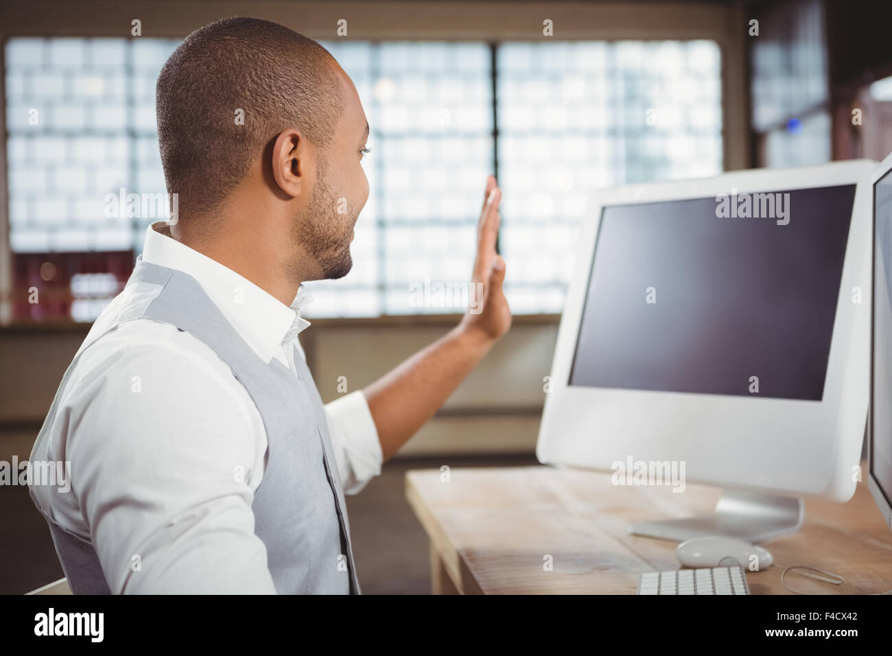 Businessman looking at computer Stock Photo - Alamy
