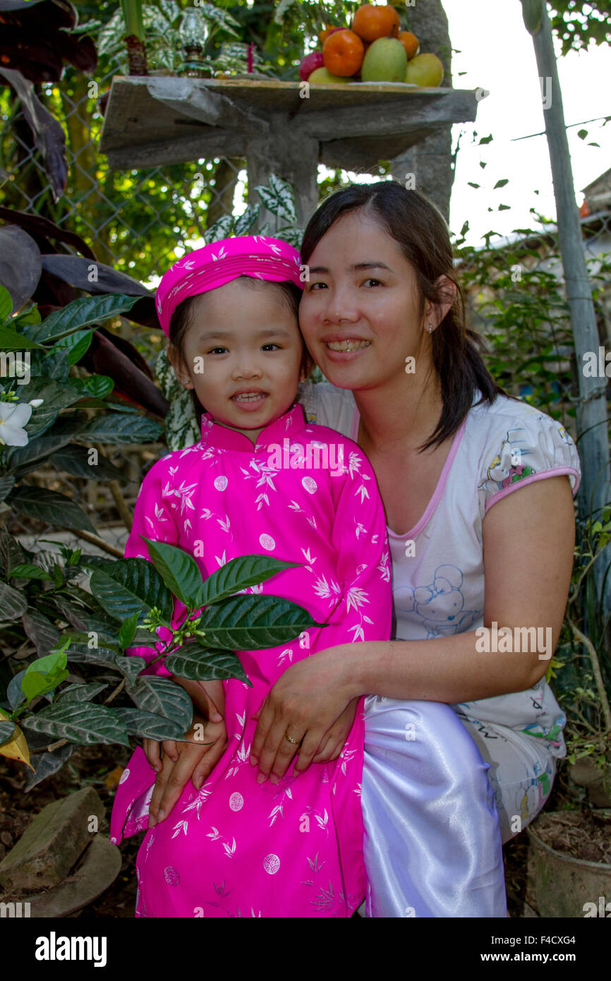 Mother and Daughter posing for New Year photo in traditional Vietnamese ...