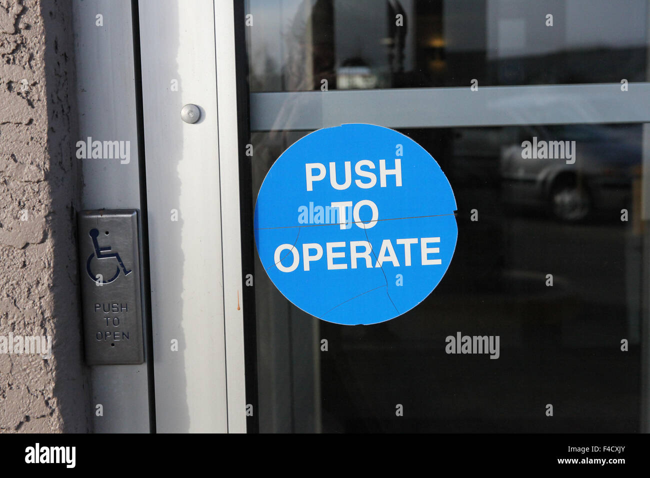Open door sign and wheel chair sign. Push to operate Stock Photo - Alamy