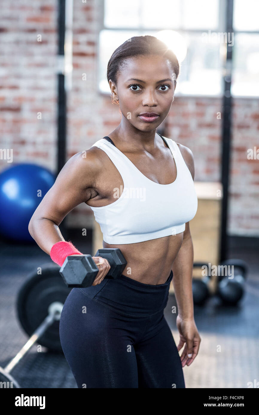 Muscular woman posing to the camera Stock Photo - Alamy