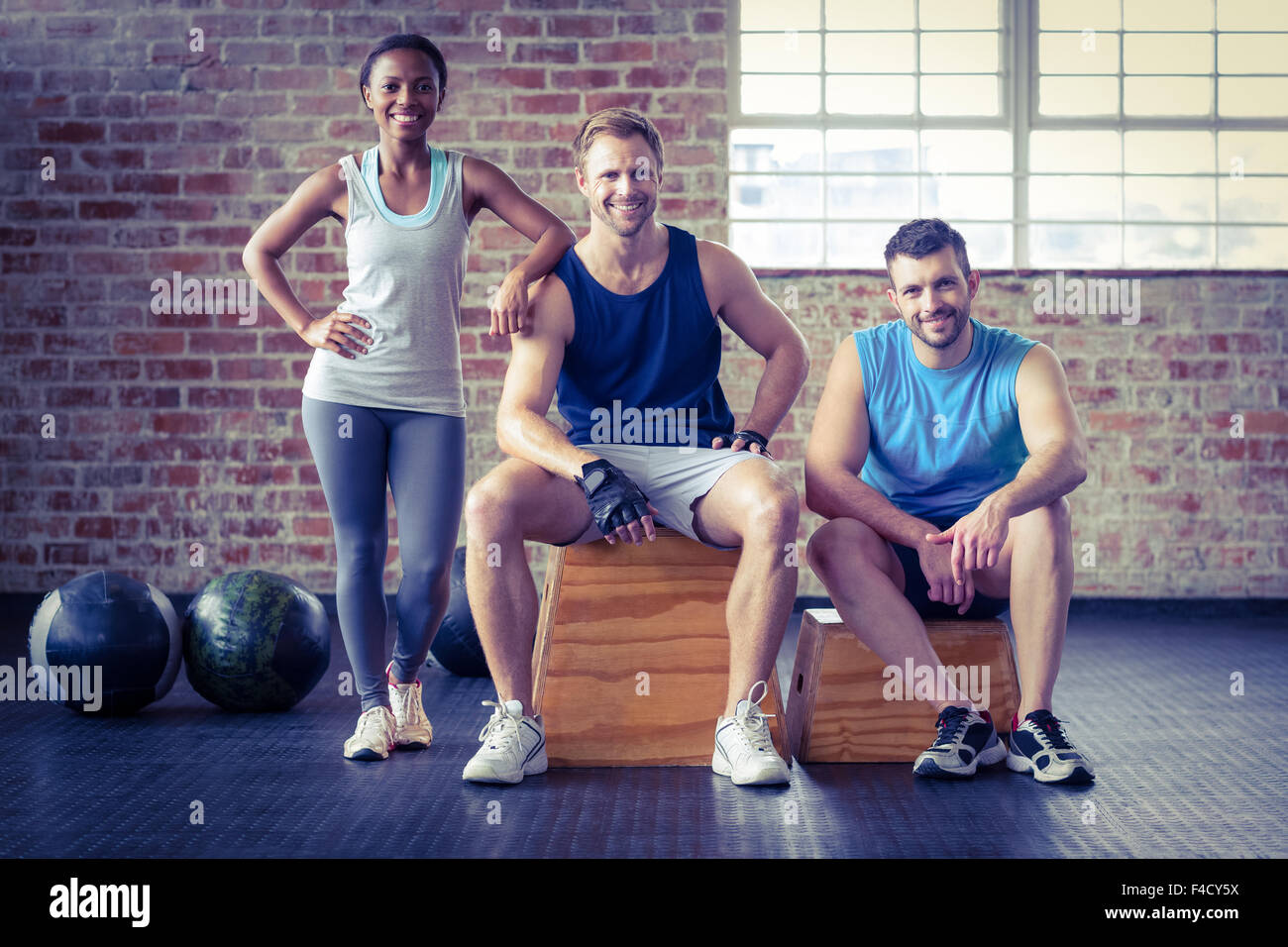 Fit smiling people posing together Stock Photo - Alamy