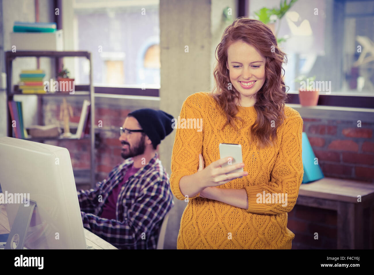 Young beautiful woman holding smartphone Stock Photo - Alamy