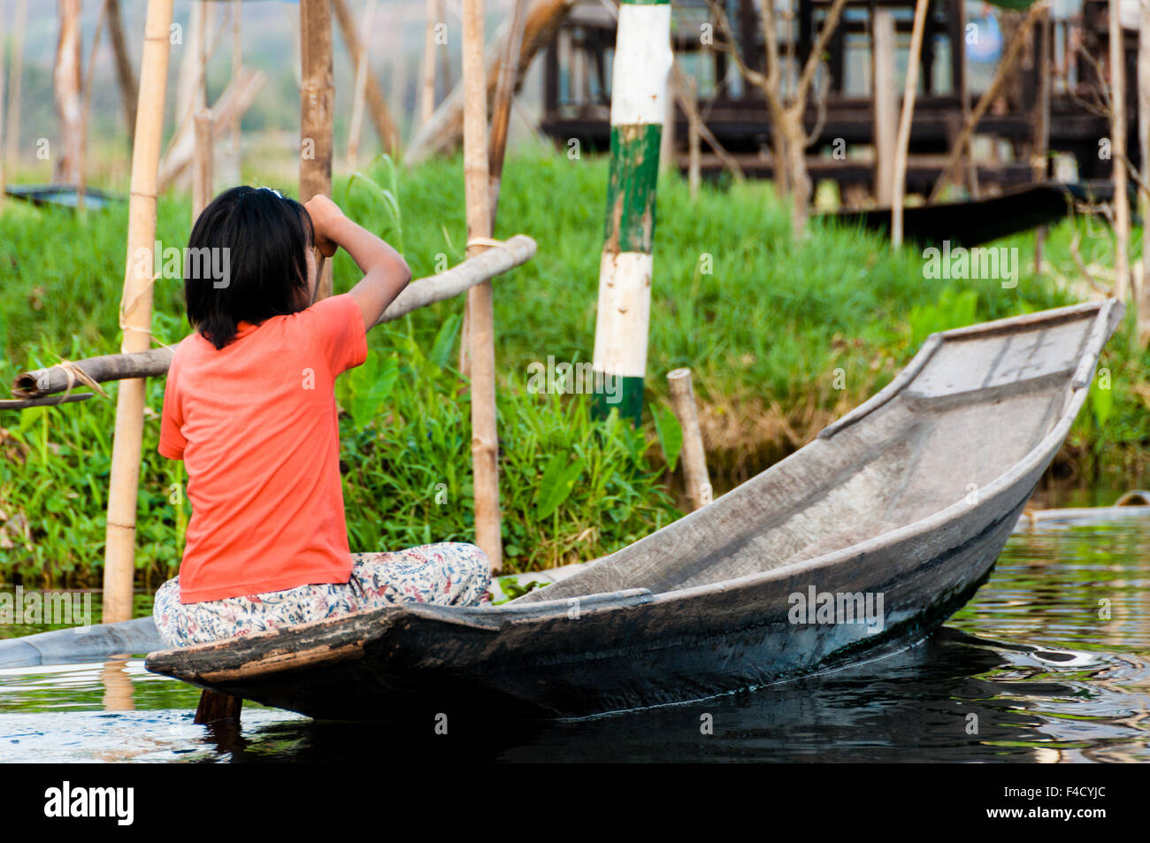 Asian girl rowing on boat at Inle Lake Stock Photo - Alamy