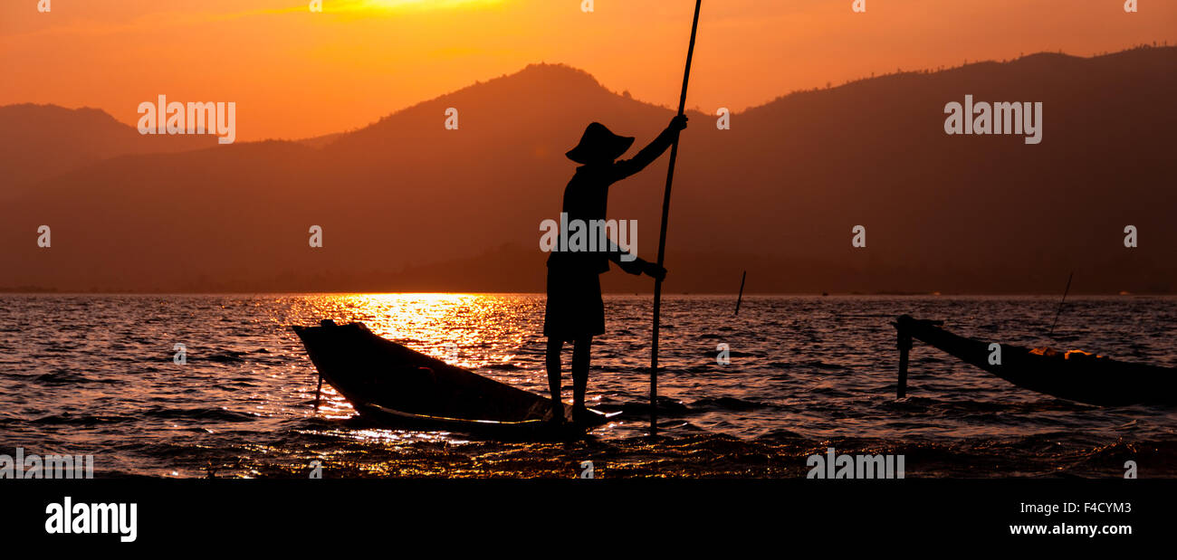 Silhouette of fisherman at sunset Inle Lake Stock Photo - Alamy