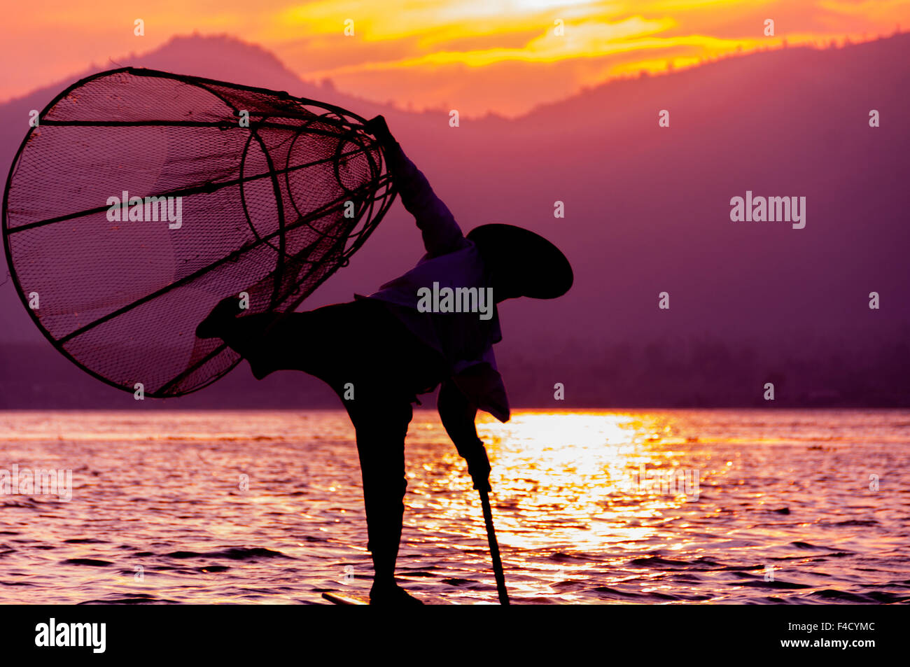 Silhouette of fisherman at sunset Inle Lake Stock Photo - Alamy
