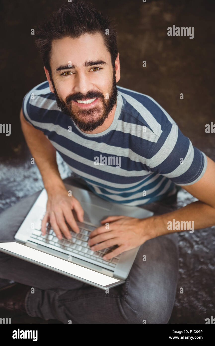 Young businessman holding laptop typing hi-res stock photography and images - Alamy