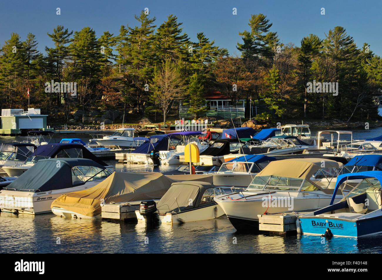 Canada, Ontario, Dorset. Boats in marina on Raven Lake. Credit as: Mike ...
