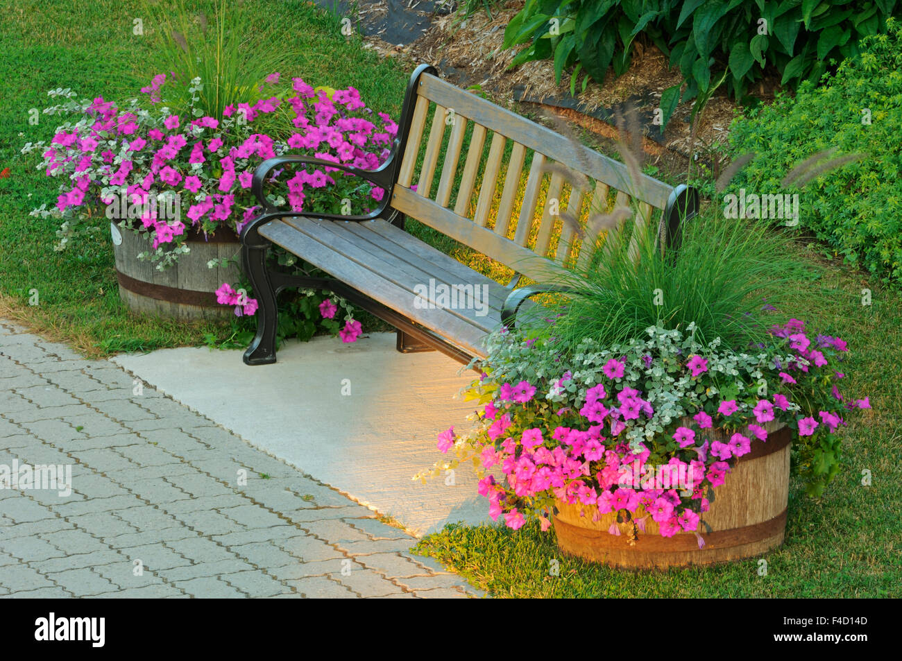 Canada, Ontario, Port Carling. Bench flanked by flower pots. Credit as ...