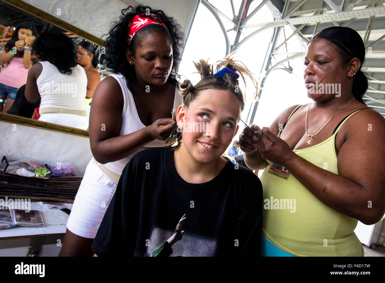 Young girl getting her hair braided, Havana, Cuba Stock Photo - Alamy