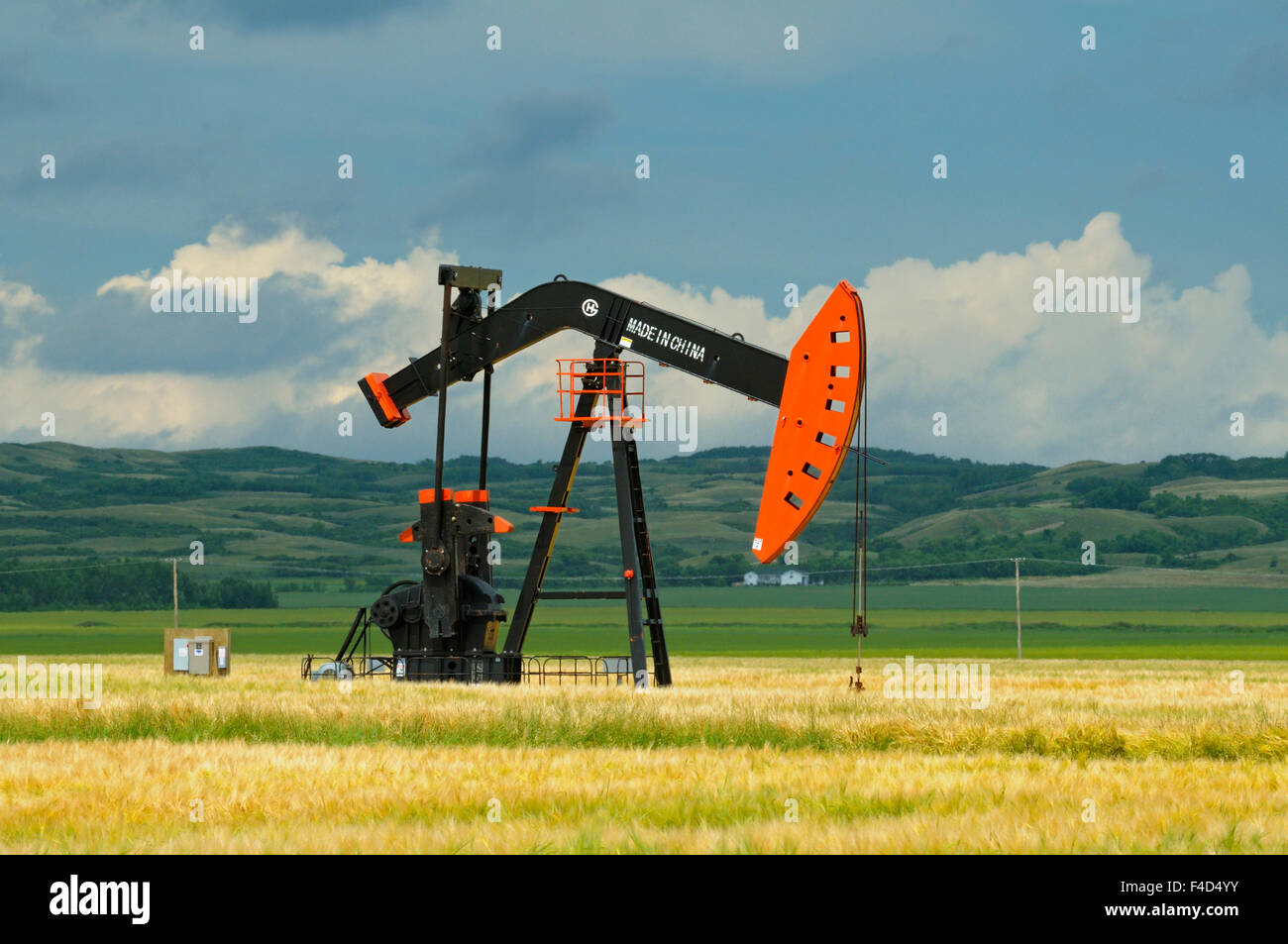Canada, Saskatchewan, Carlyle. Oil well pump in field. Credit as: Mike ...