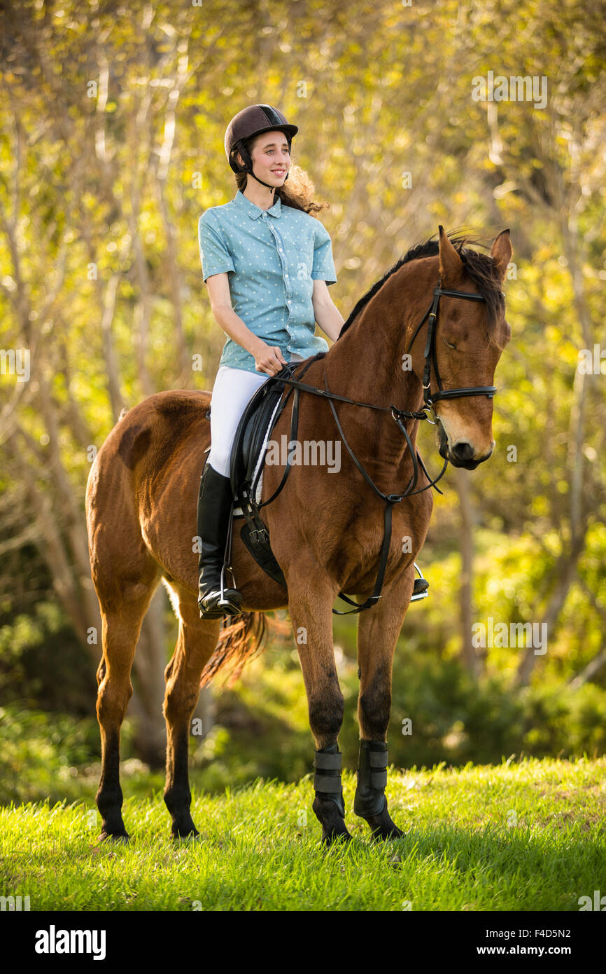 Young woman riding her horse Stock Photo - Alamy