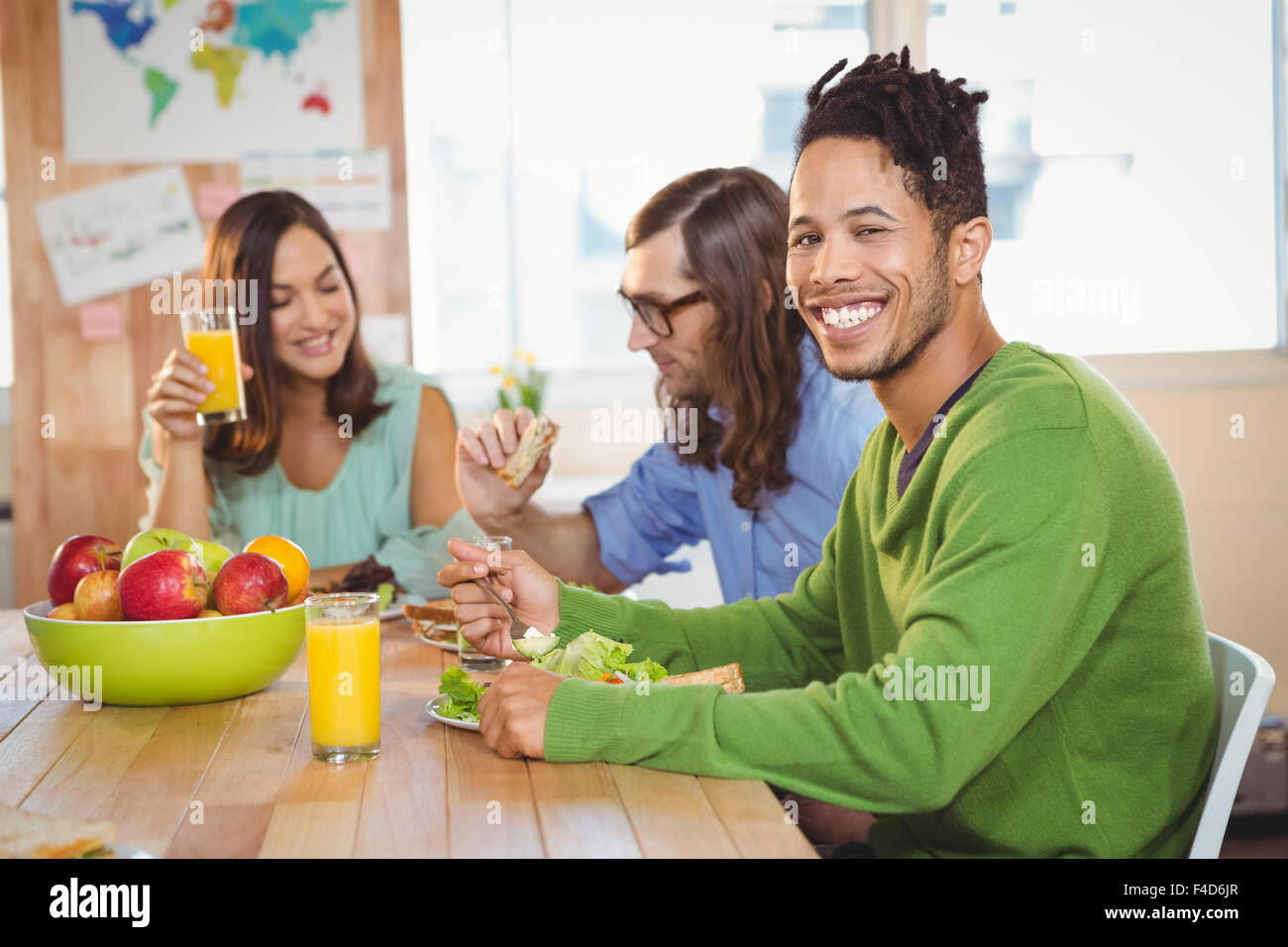 Happy business people having breakfast Stock Photo - Alamy