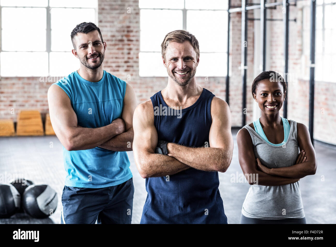 Fit smiling people posing together Stock Photo - Alamy