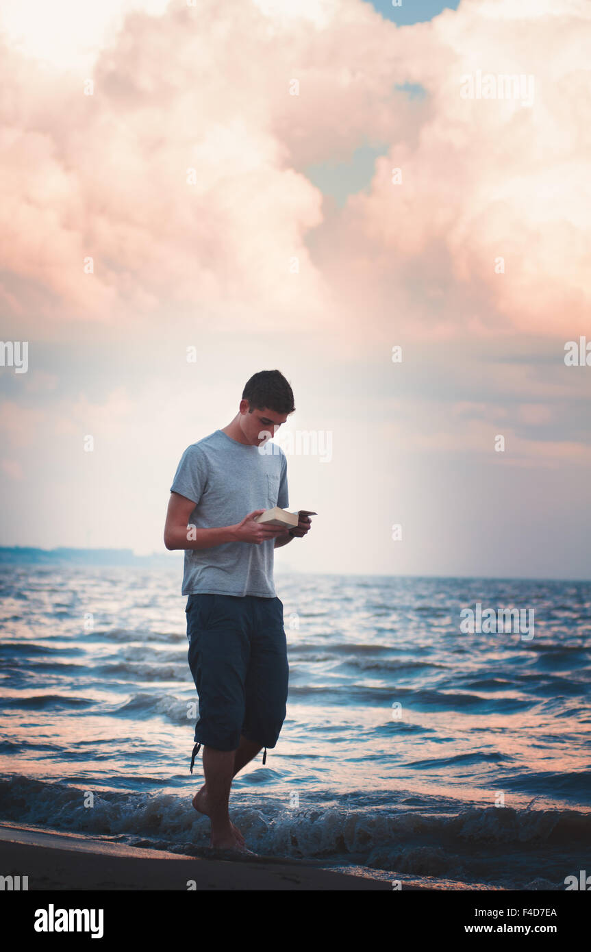 Man reading a book while walking hi-res stock photography and images ...