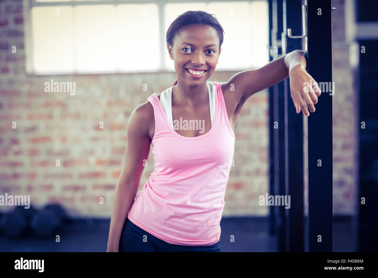Fit smiling woman face to the camera Stock Photo - Alamy