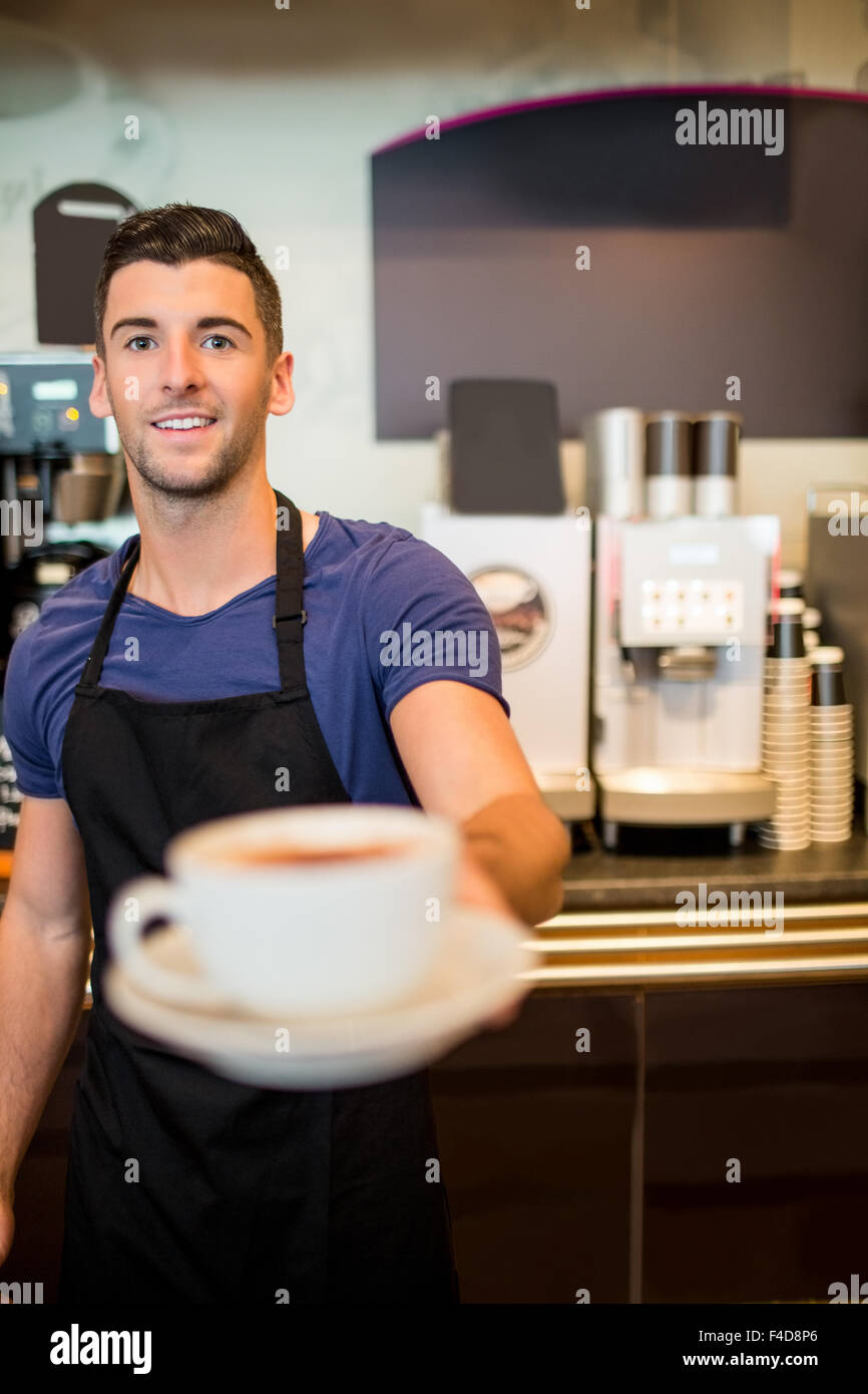 Handsome waiter smiling at camera Stock Photo - Alamy