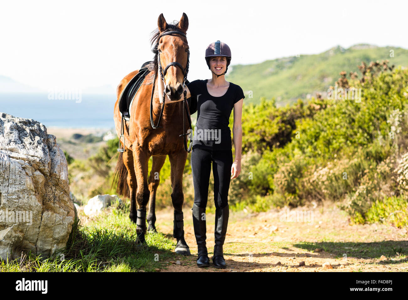 Happy woman walking with her horse Stock Photo - Alamy