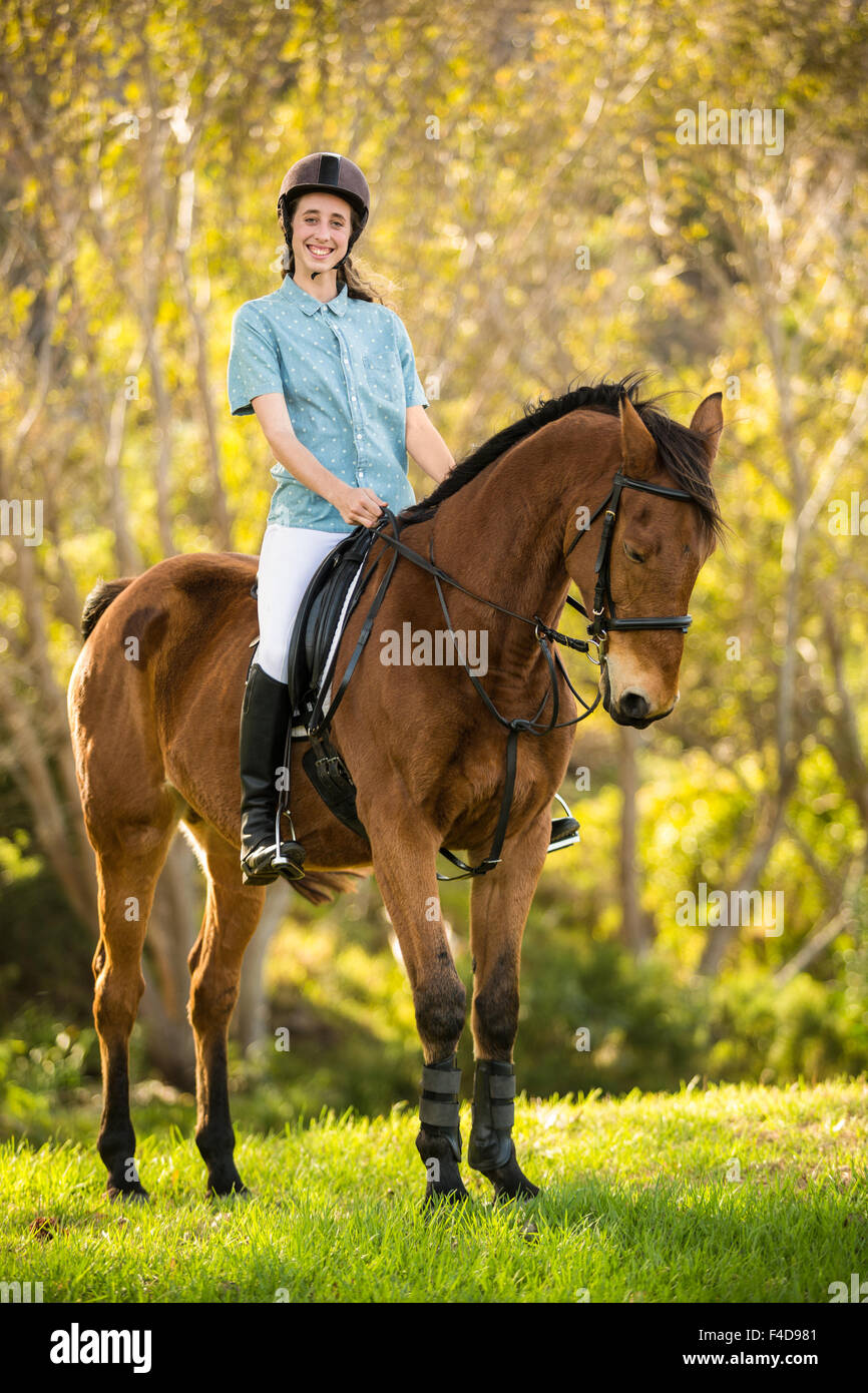Young woman riding her horse Stock Photo - Alamy