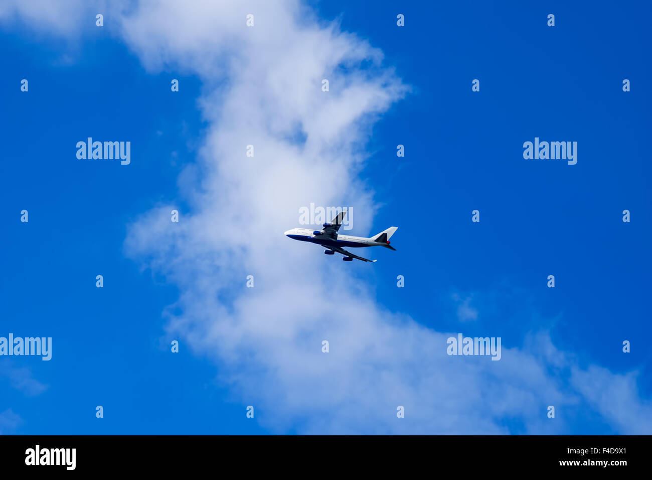 Airplane flying into the clouds Stock Photo - Alamy